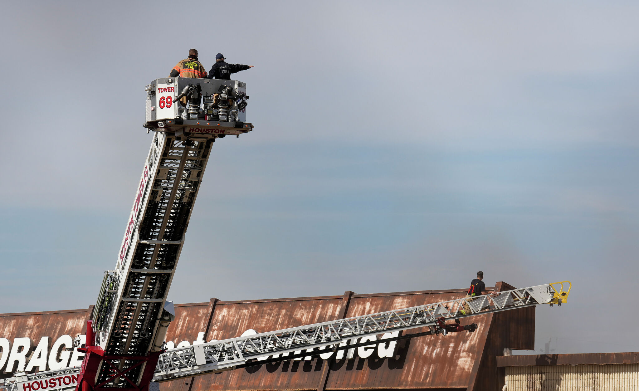 Houston fire: Crews working to put out warehouse fire, roof partially