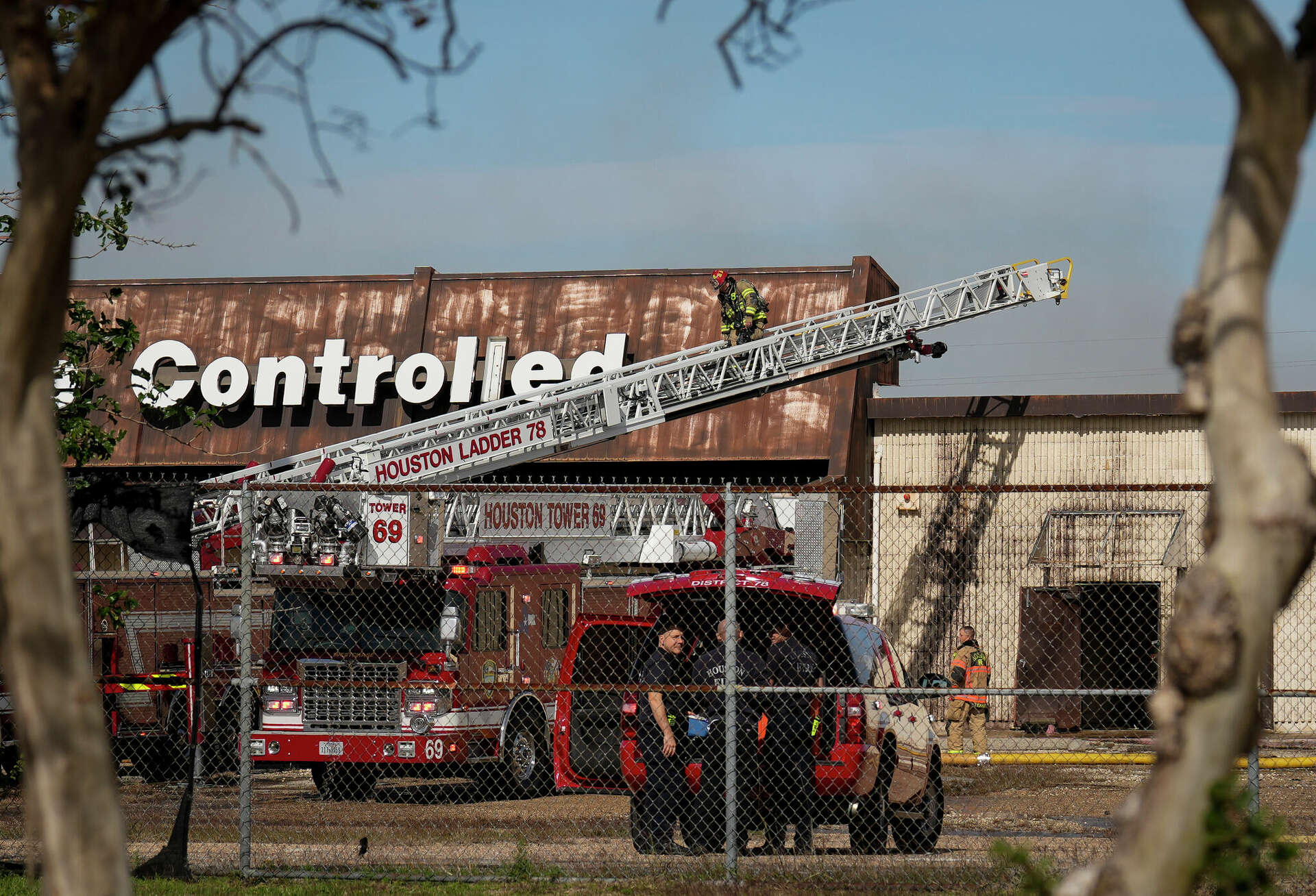 Houston fire: Crews working to put out warehouse fire, roof partially