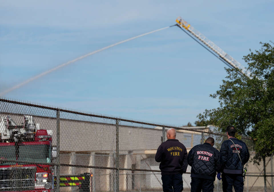 Houston fire: Crews working to put out warehouse fire, roof partially