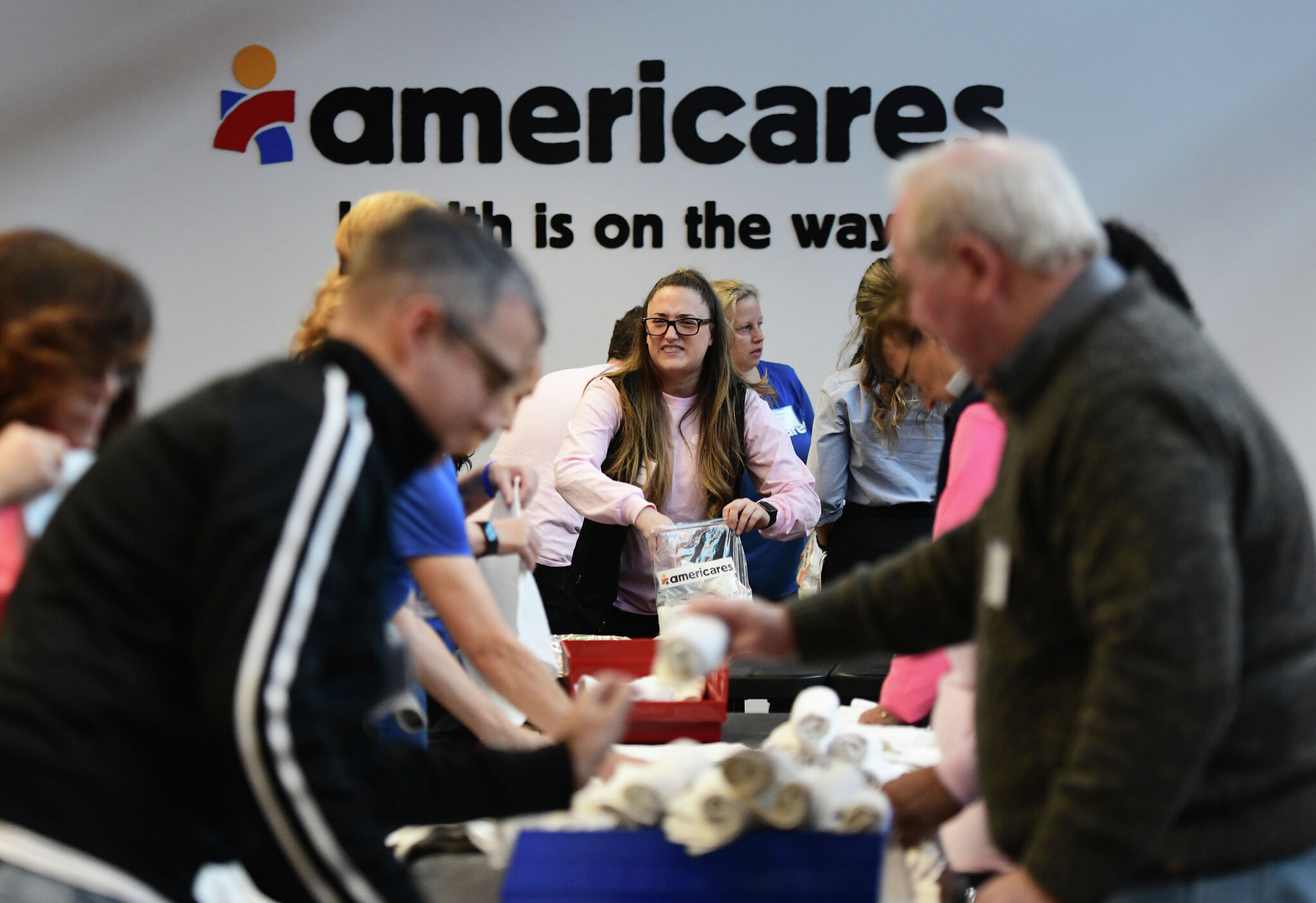 Photos: Volunteers at Americares pack kits for #GivingTuesday