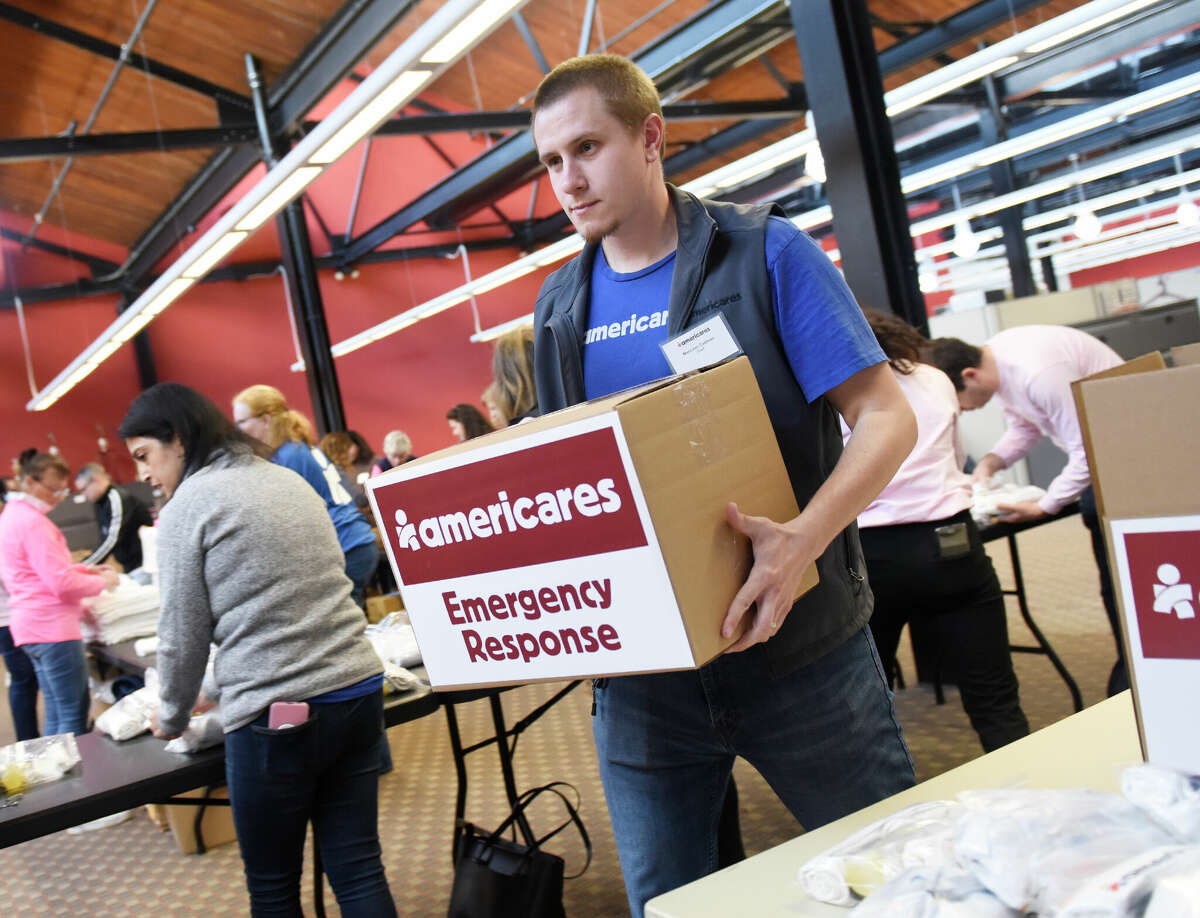 Photos: Volunteers at Americares pack kits for #GivingTuesday