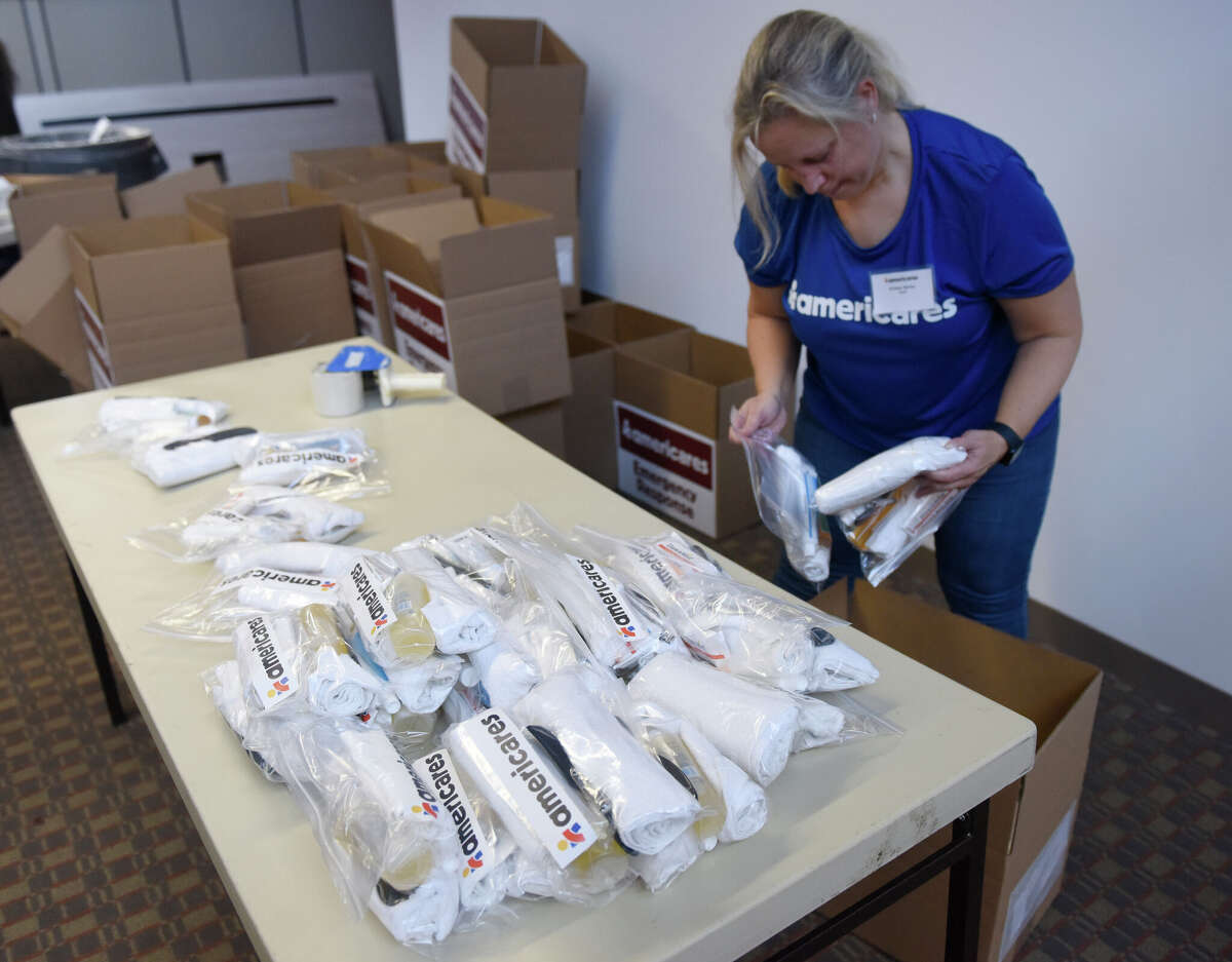 Photos: Volunteers at Americares pack kits for #GivingTuesday