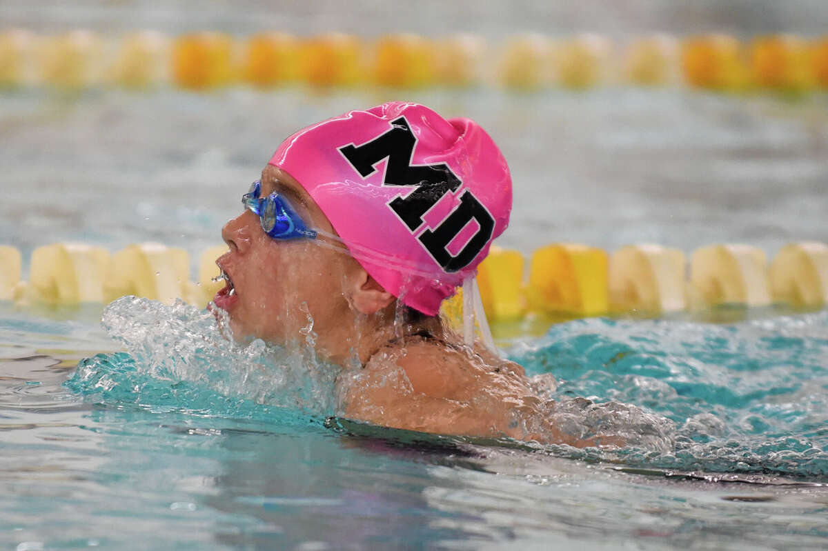 Midland Dolphins wear pink swim caps to support coach battling cancer