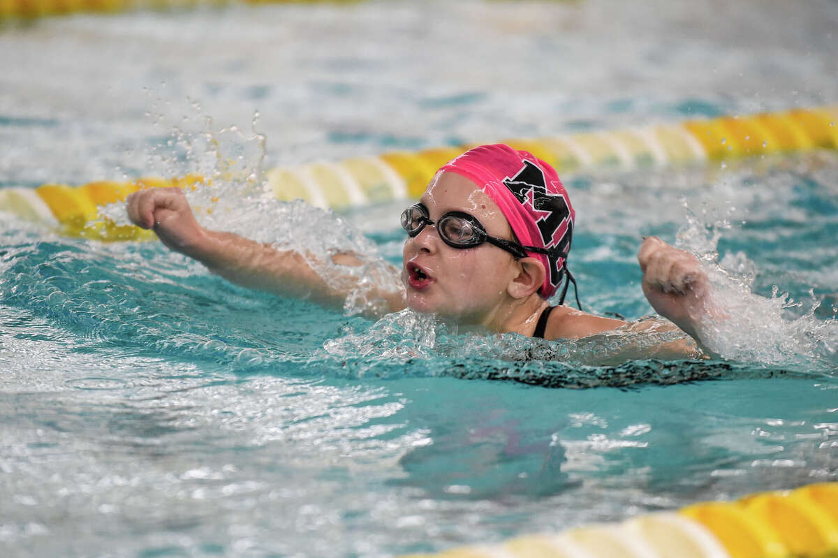Midland Dolphins wear pink swim caps to support coach battling cancer