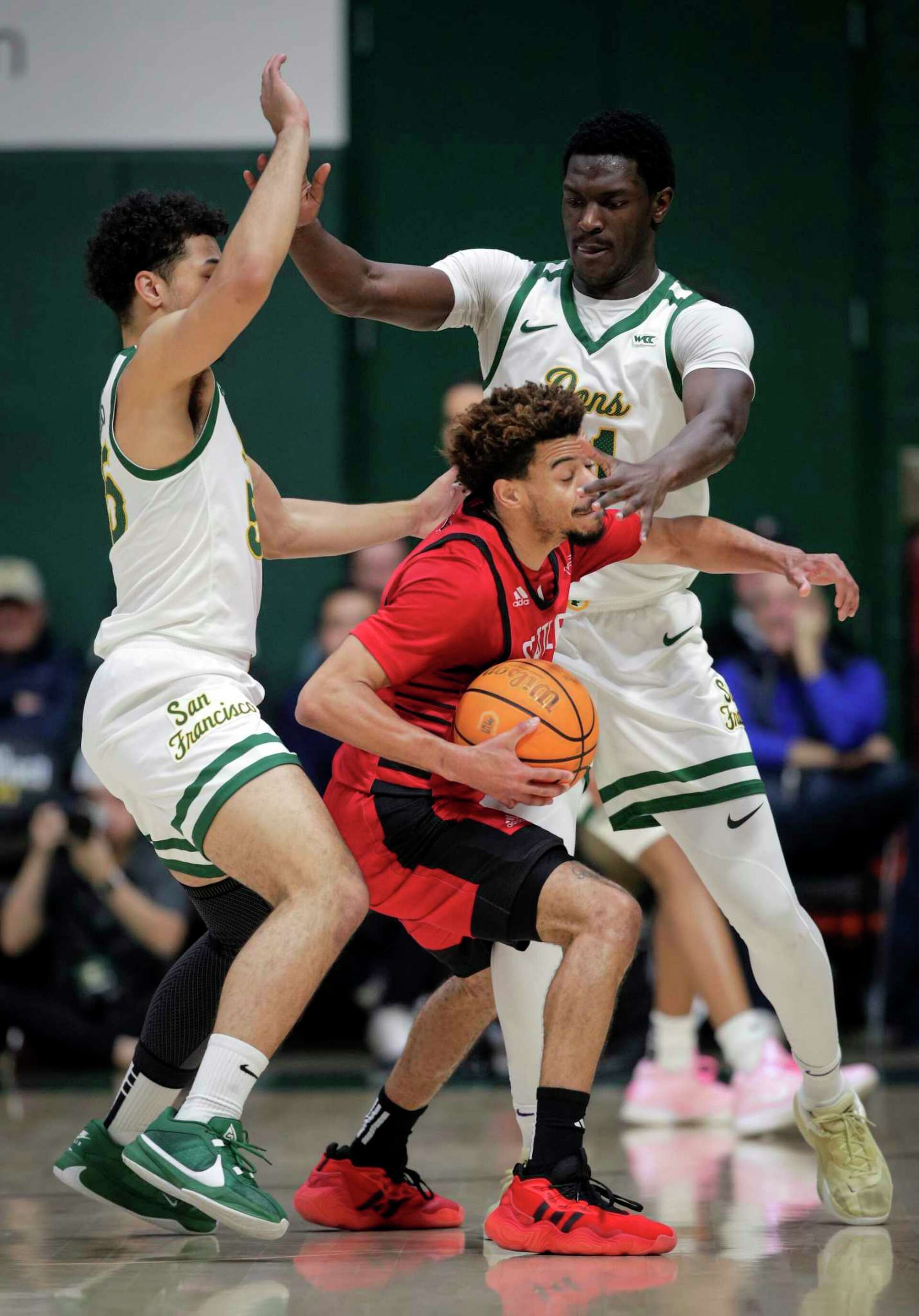 USF men overcome 15-point deficit to edge Seattle
