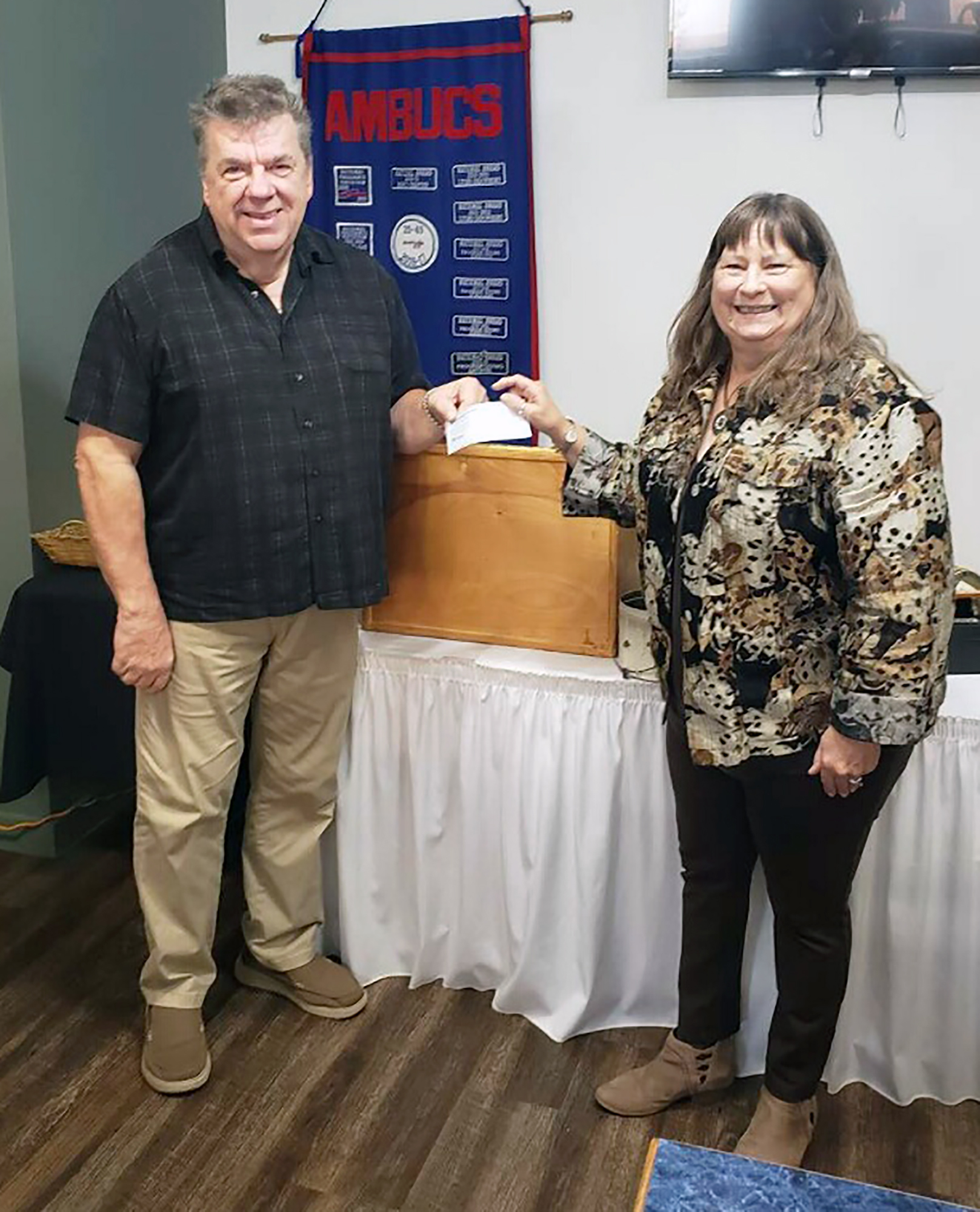 Ambucs makes donation to New Directions center