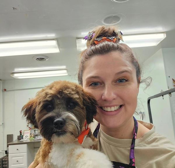 Amber Carter enjoys smiles on parents' faces after grooming their dogs