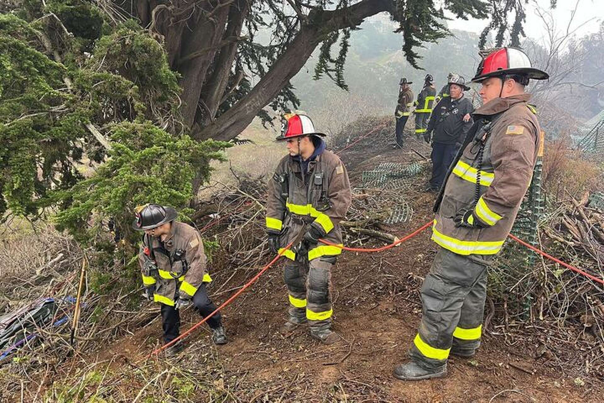 Car falls 150 feet down San Francisco embankment amid rainy weather