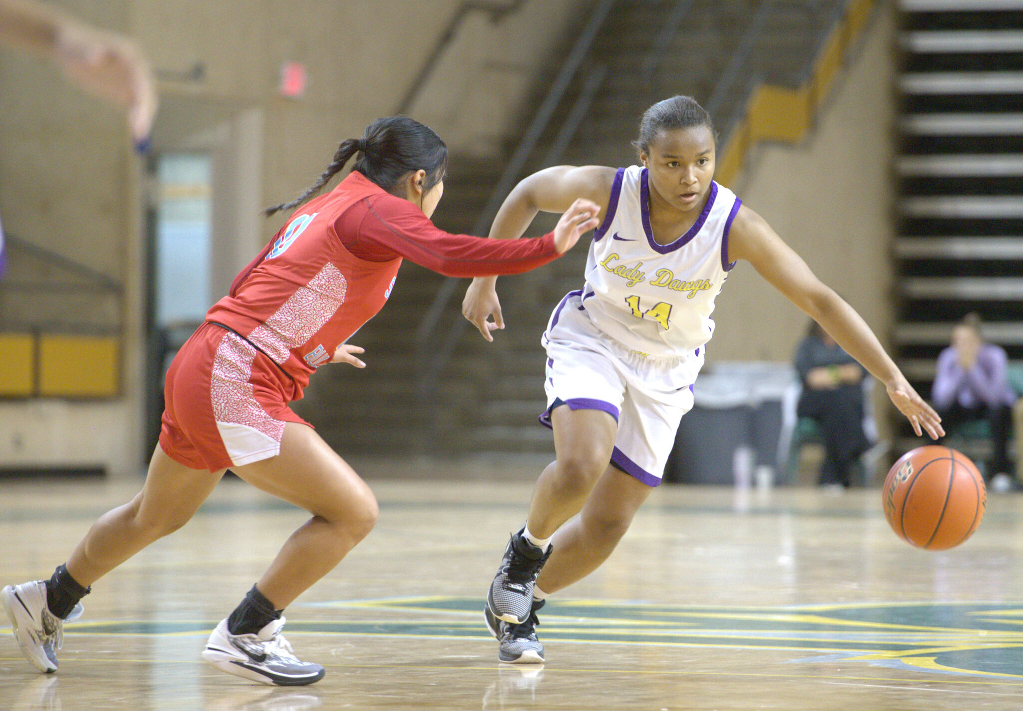 Jaleena Jones runs the floor for playoff-bound Midland High basketball