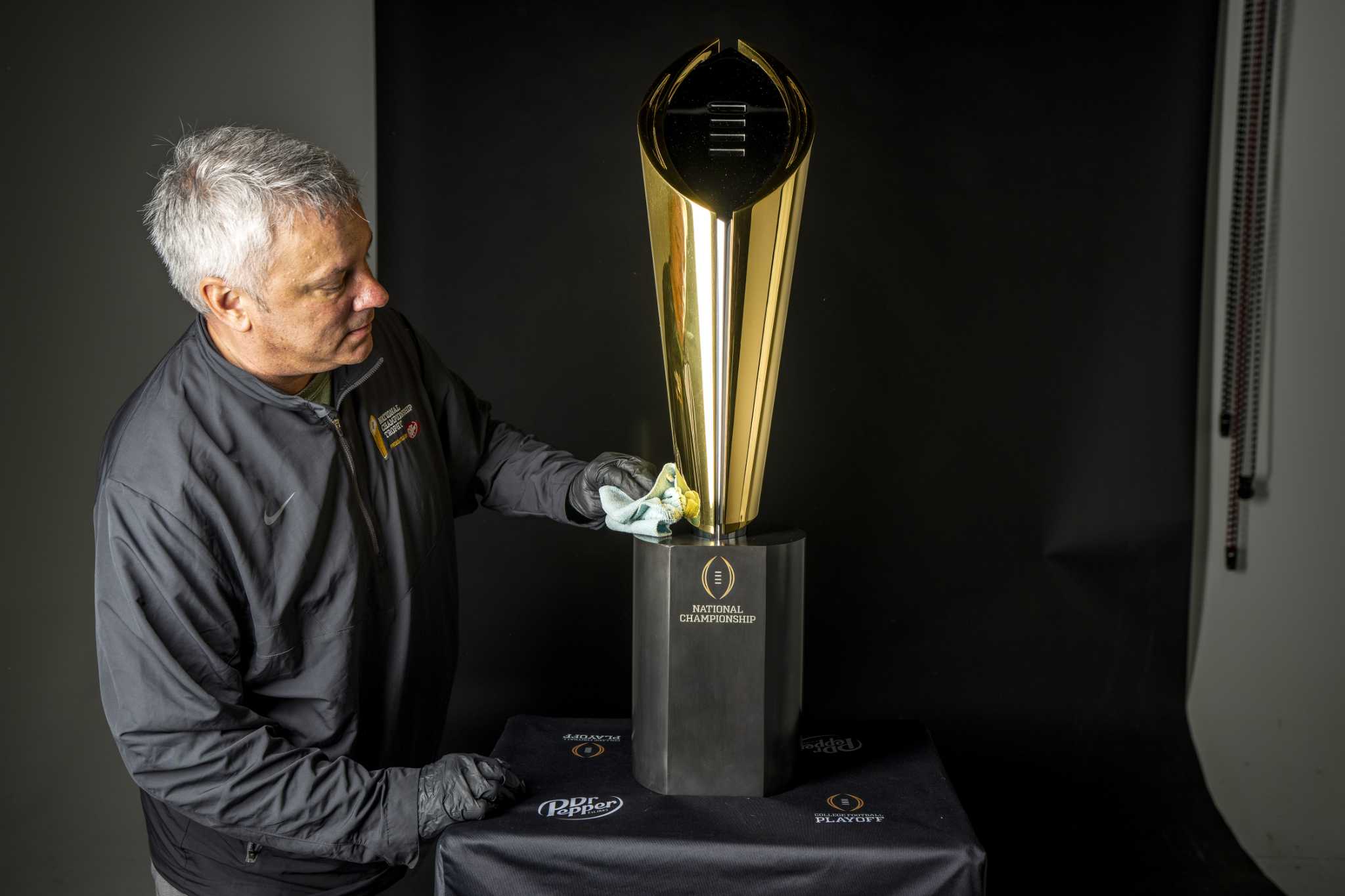 CFP championship trophy on tour before Michigan-Washington title game