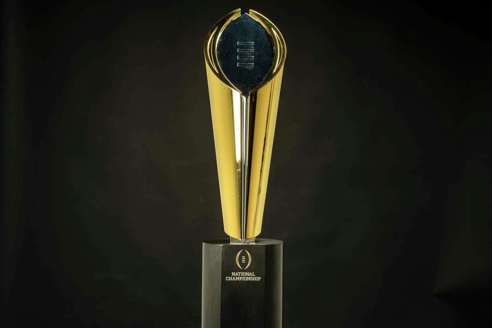 CFP championship trophy on tour before Michigan-Washington title game