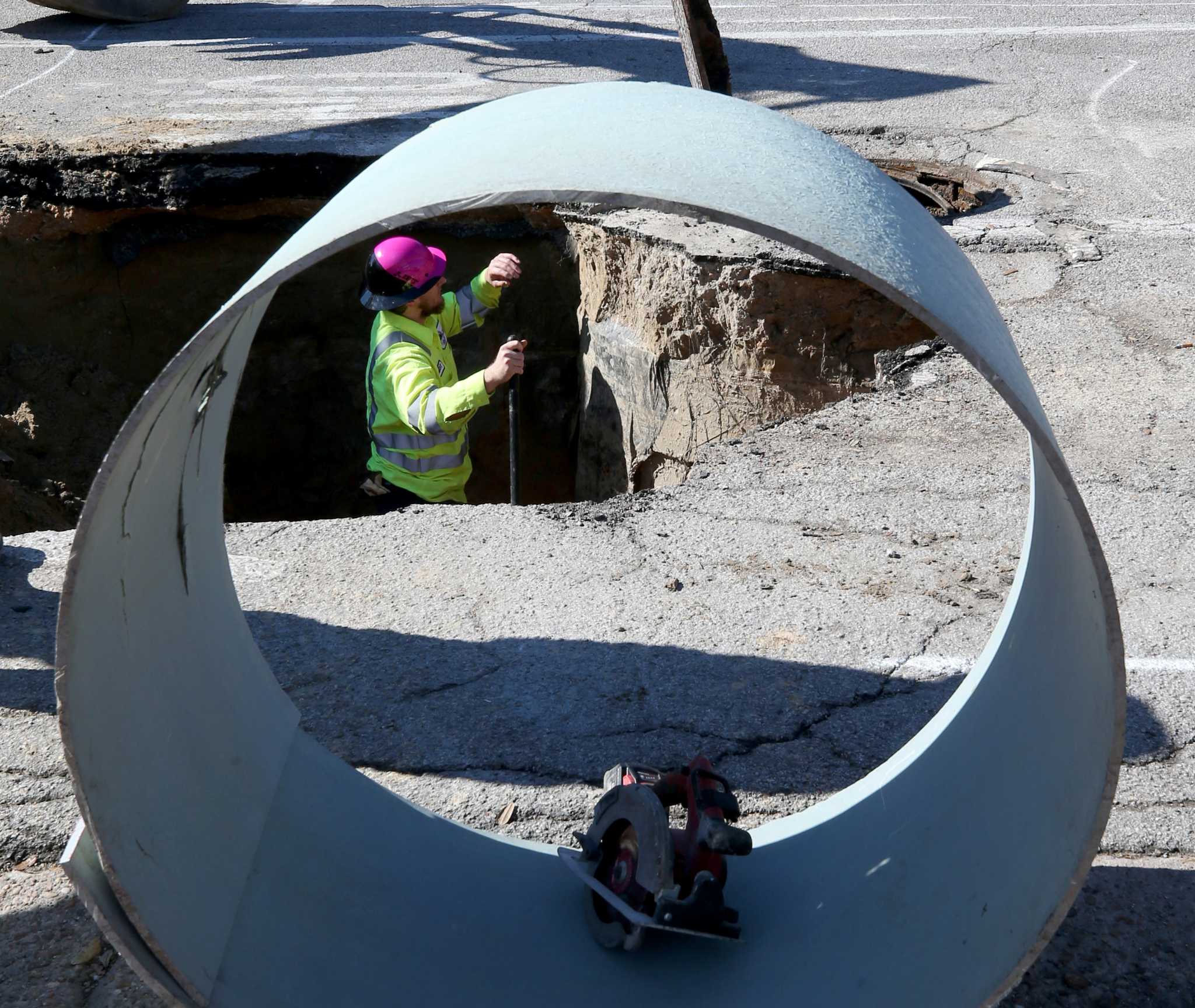 Galveston road repaired with new manhole