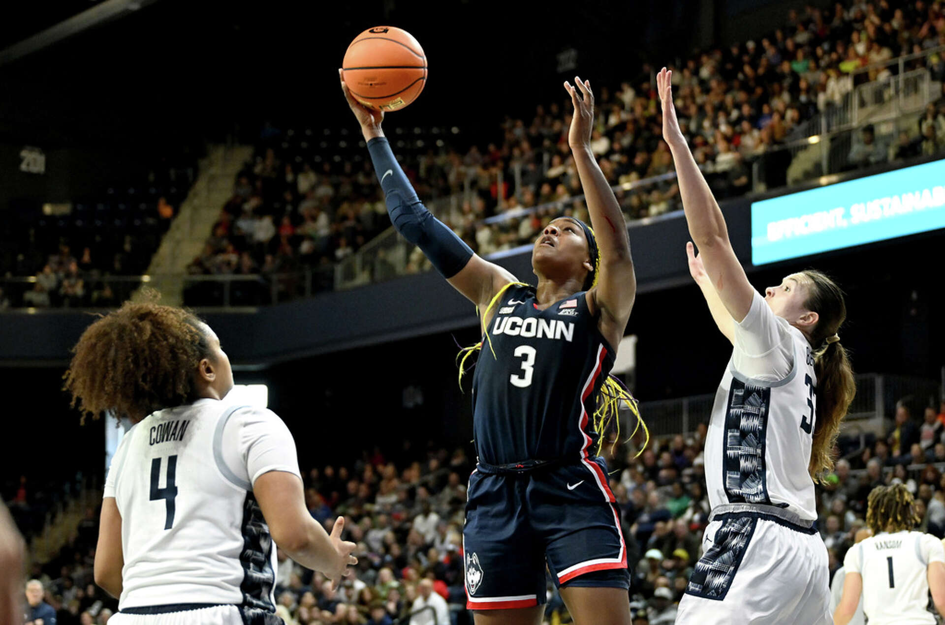 UConn women's basketball's Aaliyah Edwards helped by Ice Brady