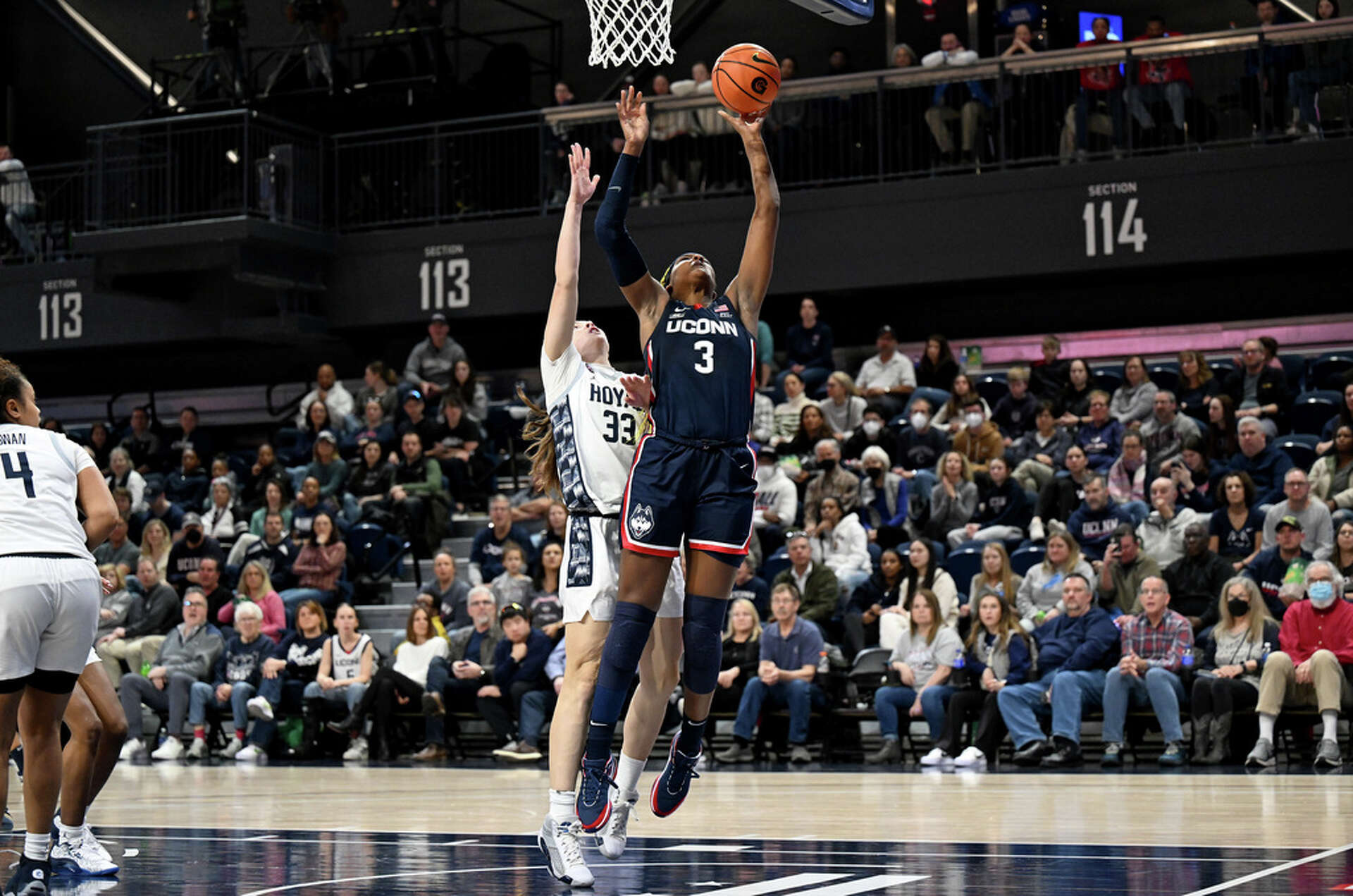 UConn women's basketball's Aaliyah Edwards helped by Ice Brady