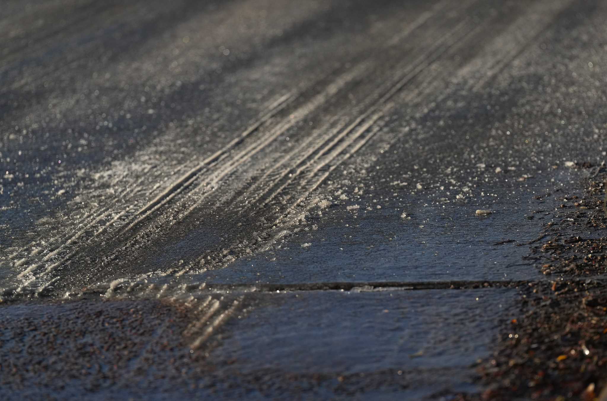 What damage can road salt and brine cause to your vehicle?