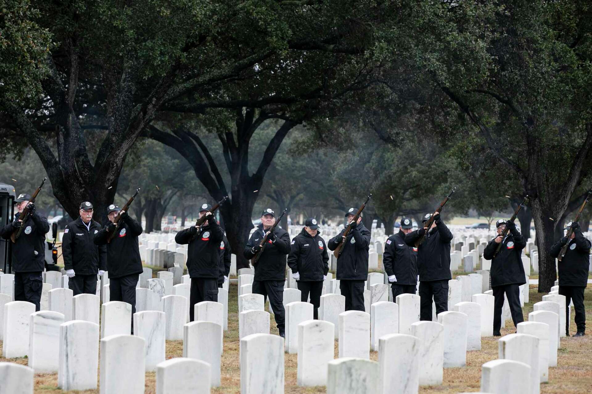 Volunteers at Fort Sam cemetery bury vets with rifle volleys, taps