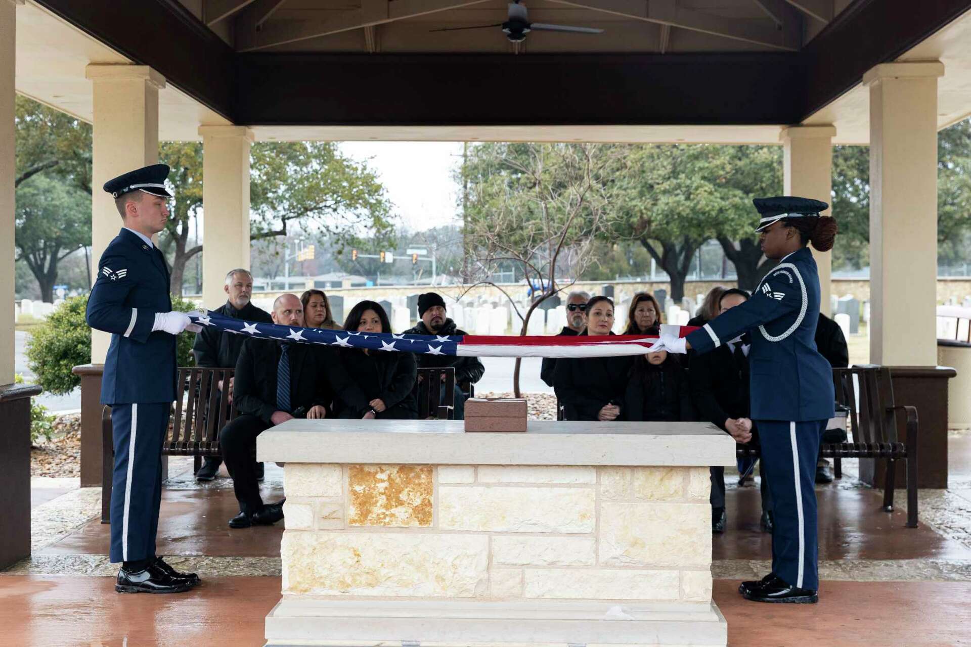 Volunteers at Fort Sam cemetery bury vets with rifle volleys, taps