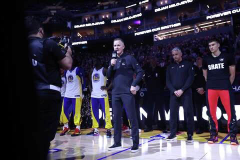 Ovation for fallen coach the first of many in Warriors’ emotional win