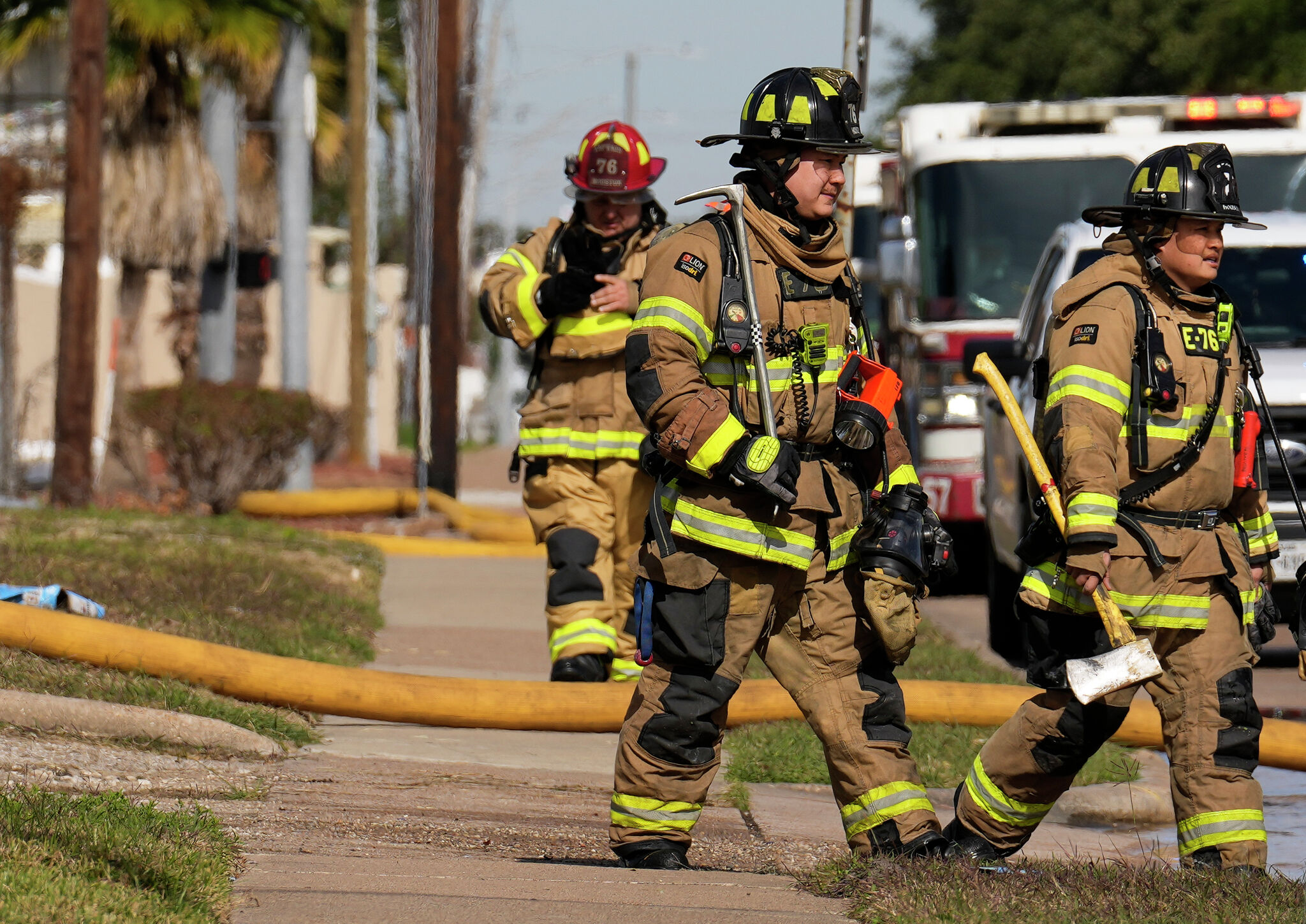 2 firefighters injured after running from gun threat, fire chief says