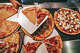 Down an unmarked hallway on the Vegas Strip, $6.50 secret pizza awaits