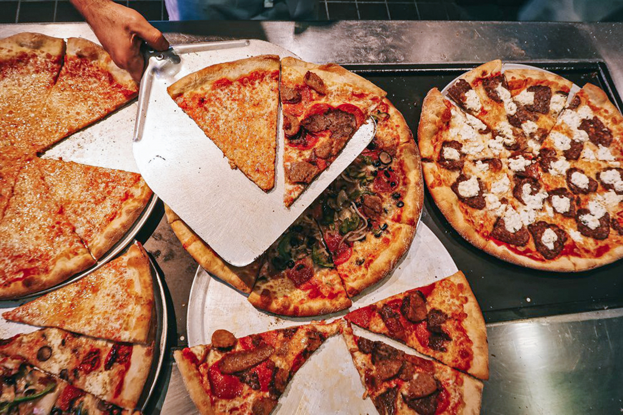 Down an unmarked hallway on the Vegas Strip, $6.50 secret pizza awaits