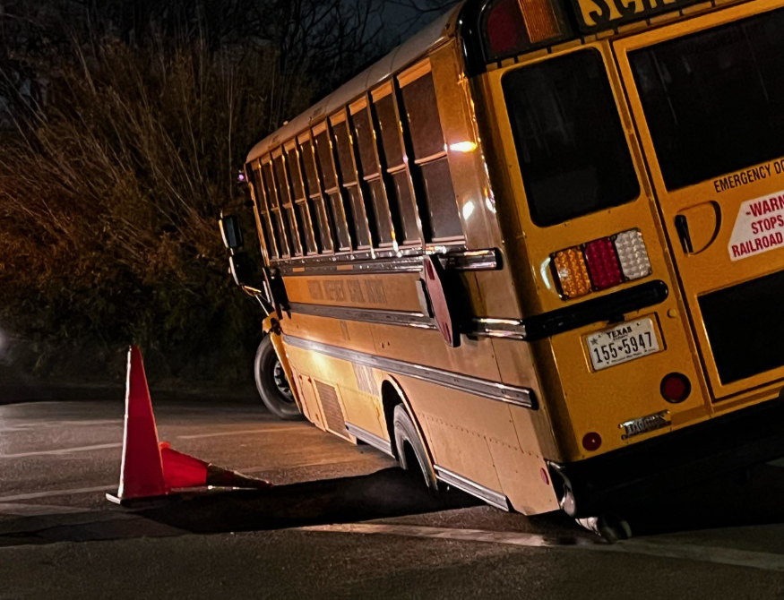 Houston school bus falls into 12-foot-deep hole in road