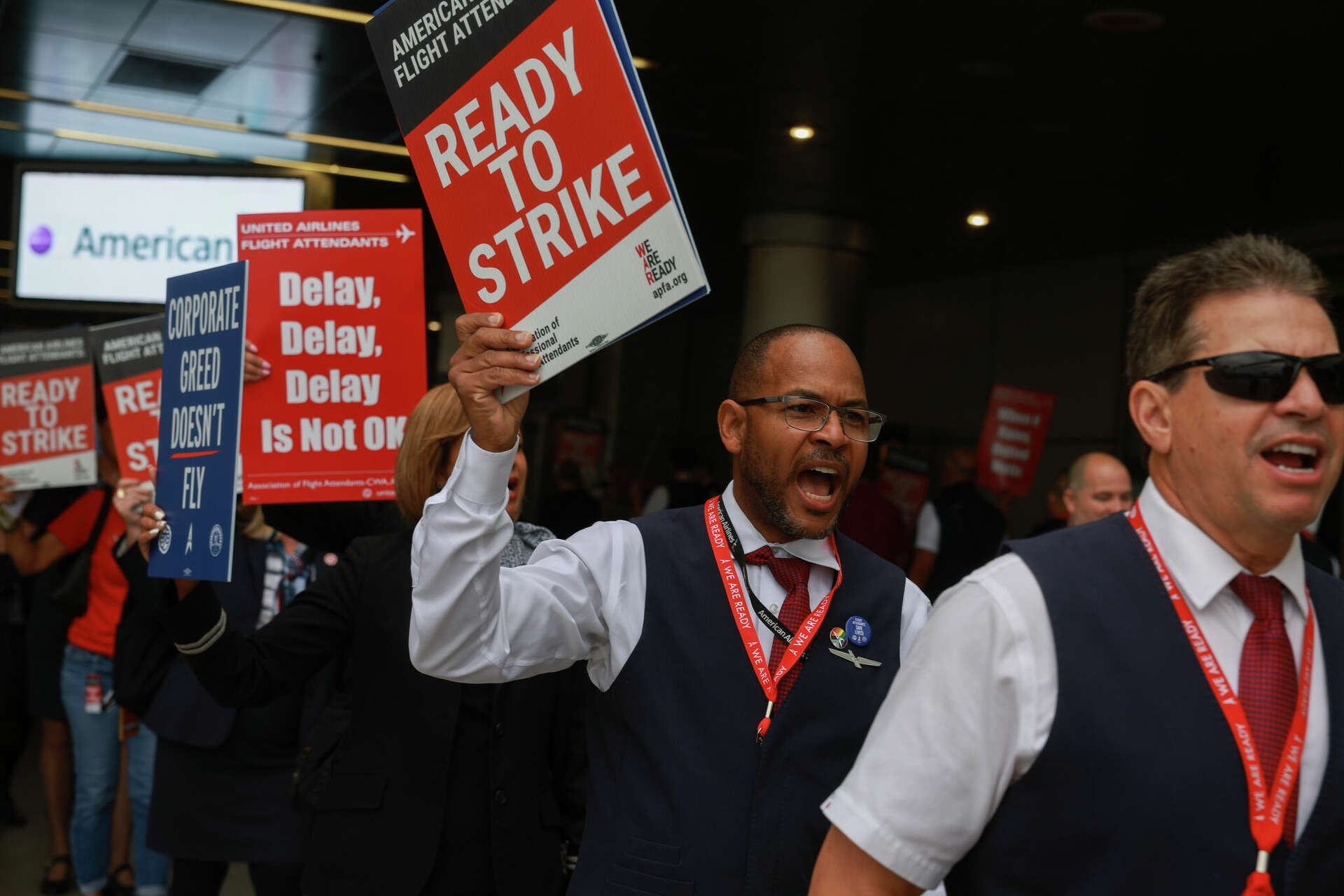 Flight attendants are picketing at airports worldwide
