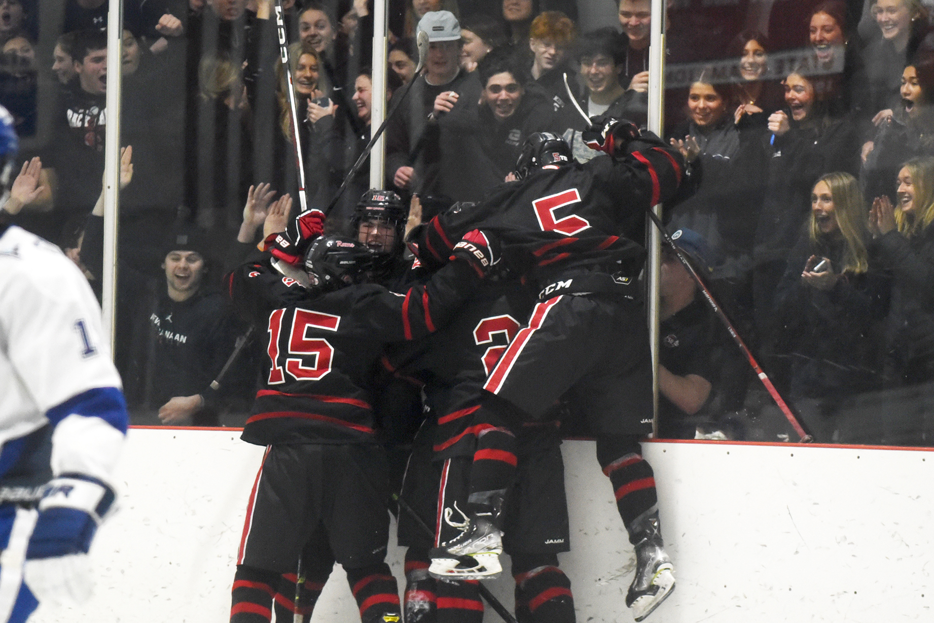 New Canaan boys hockey tips Darien on Bryce Lyden's overtime goal