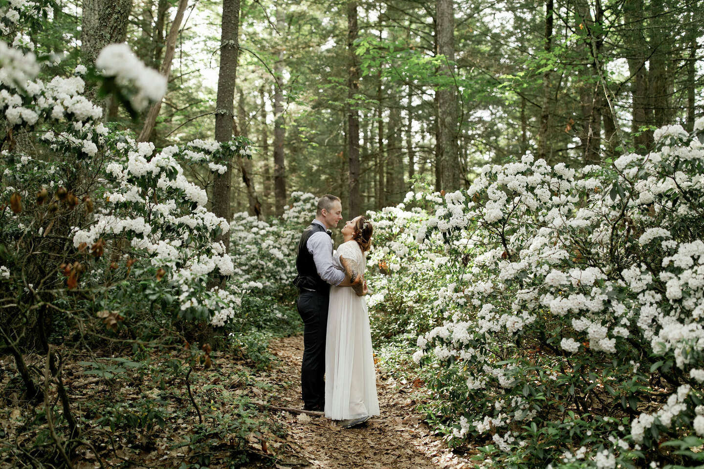 The bride wore hiking boots for Peoples Forest elopement in CT