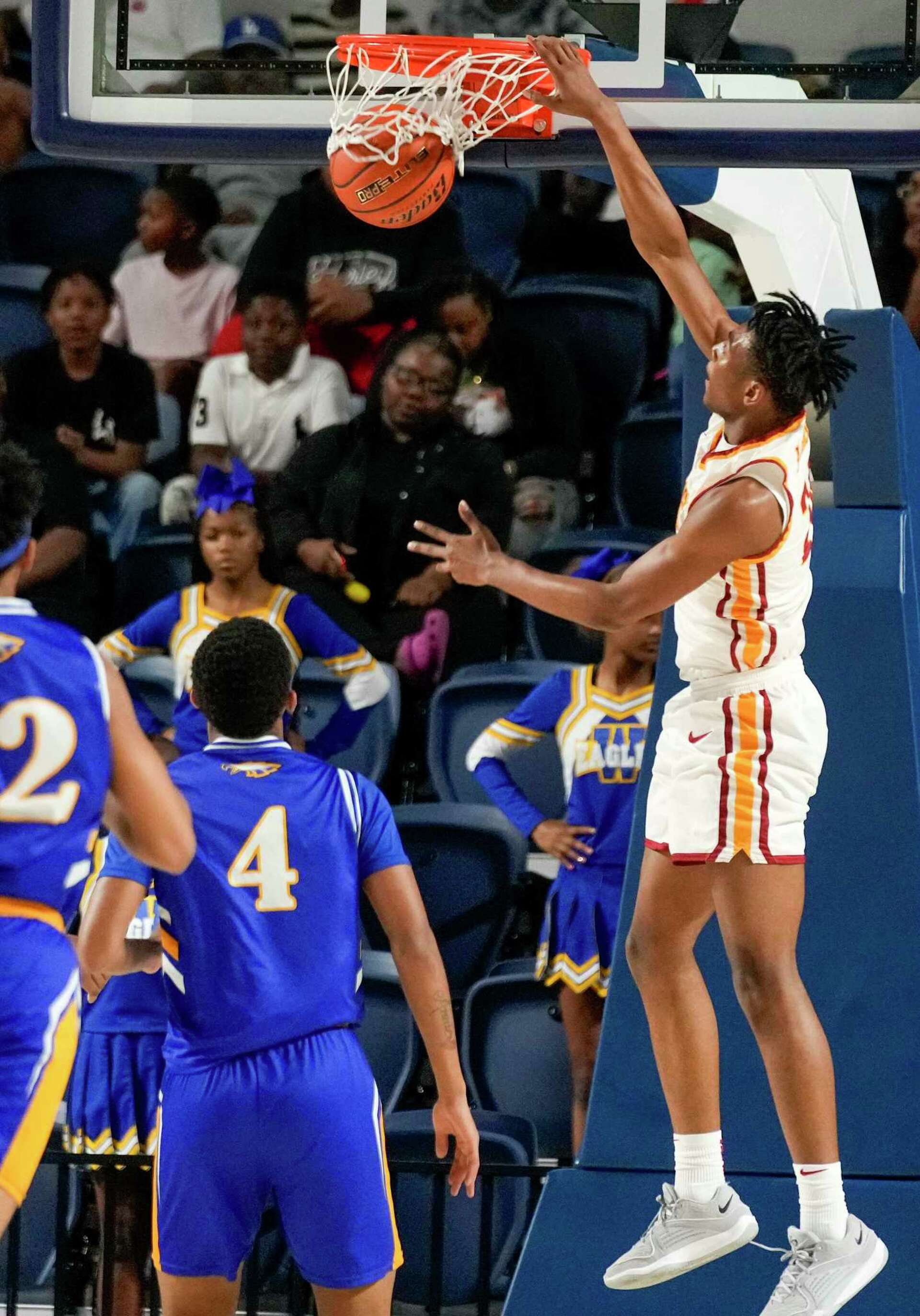 High school basketball: Washington storms into region semis