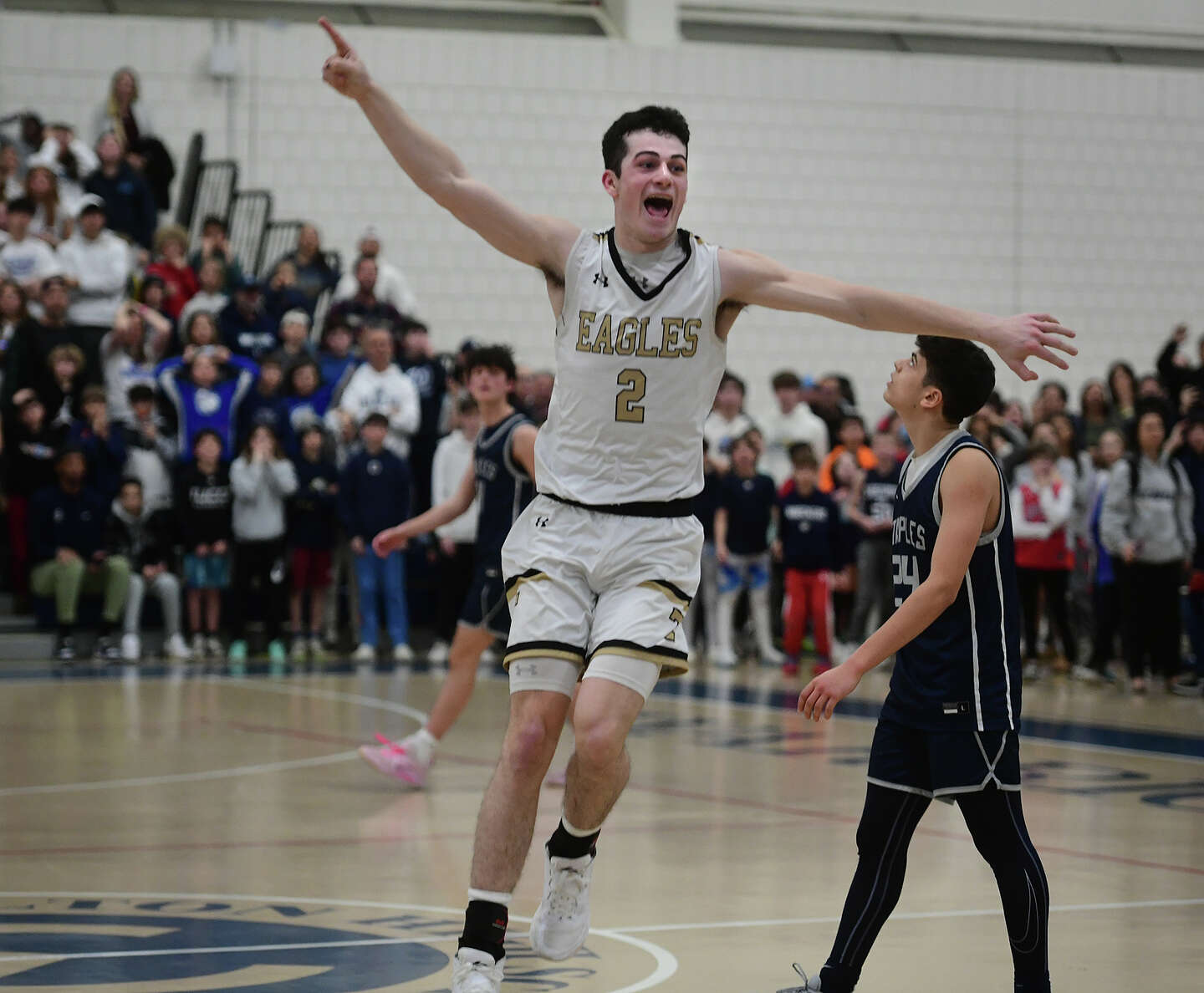 Trumbull captures FCIAC boys basketball title over Staples in OT