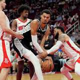 After being at death's door, Houston basketball legend Dwight Jones ...