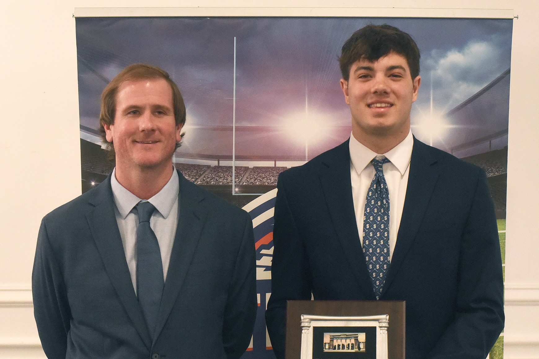 Walter Camp Foundation honors Staples QB Smith, coach Behrends