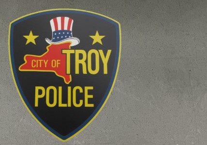 One apprehended, one at large in Troy