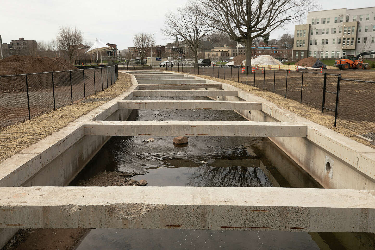 Meriden bridge reopens, another section of Harbor Brook uncovered