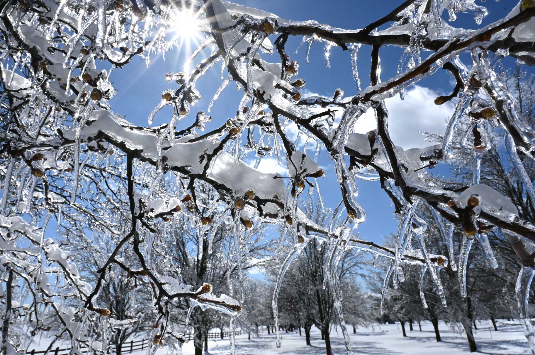 National Grid working to restore power to thousands after ice, snow