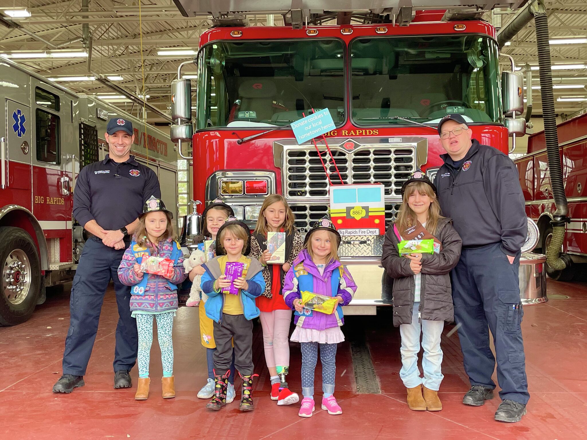Girl Scout Troop 8867 donates cookies to Big Rapids firefighters