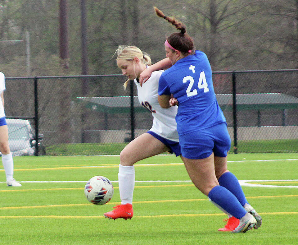 Marquette scores two goals early in each half and rolls past Roxana