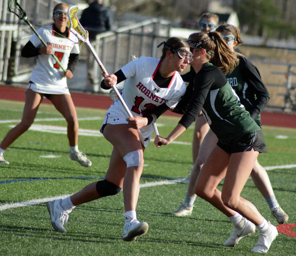 Guilford High School girls lacrosse defeats Branford in SCC match.