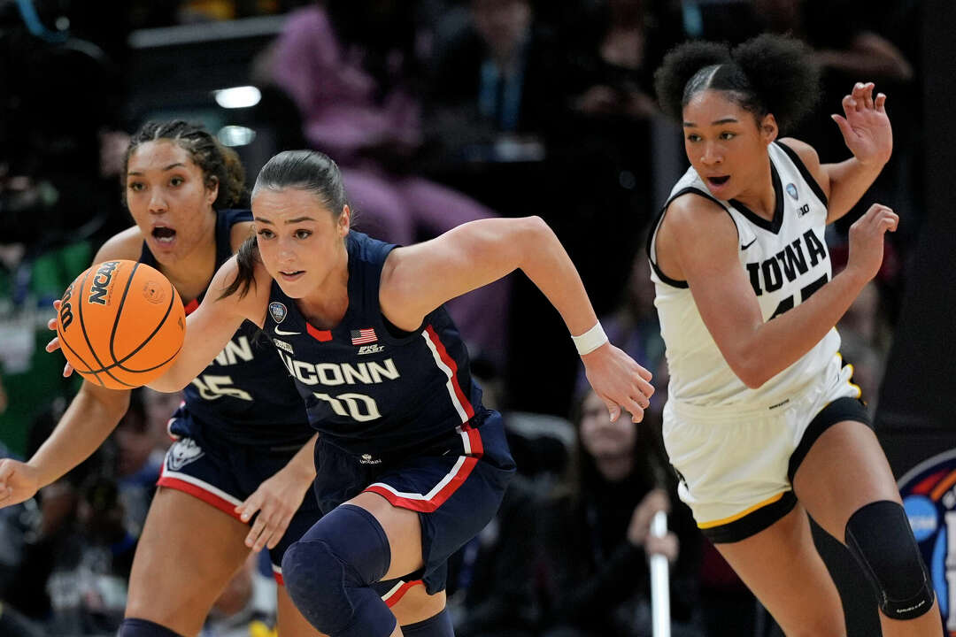 UConn's Nika Muhl leaves semifinal slowed by apparent injury vs. Iowa.