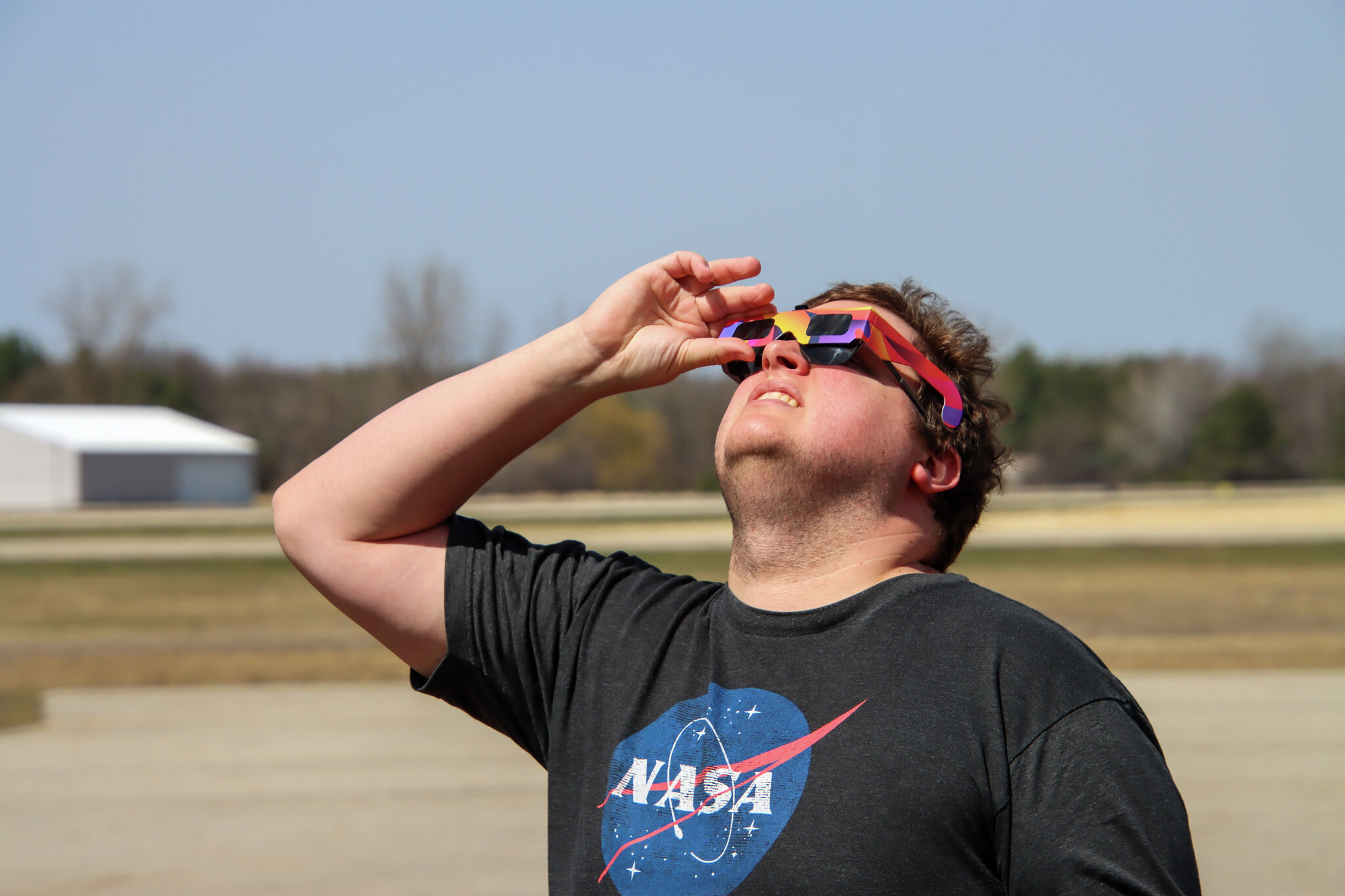 Spectators watch solar eclipse at Jack Barstow Airport