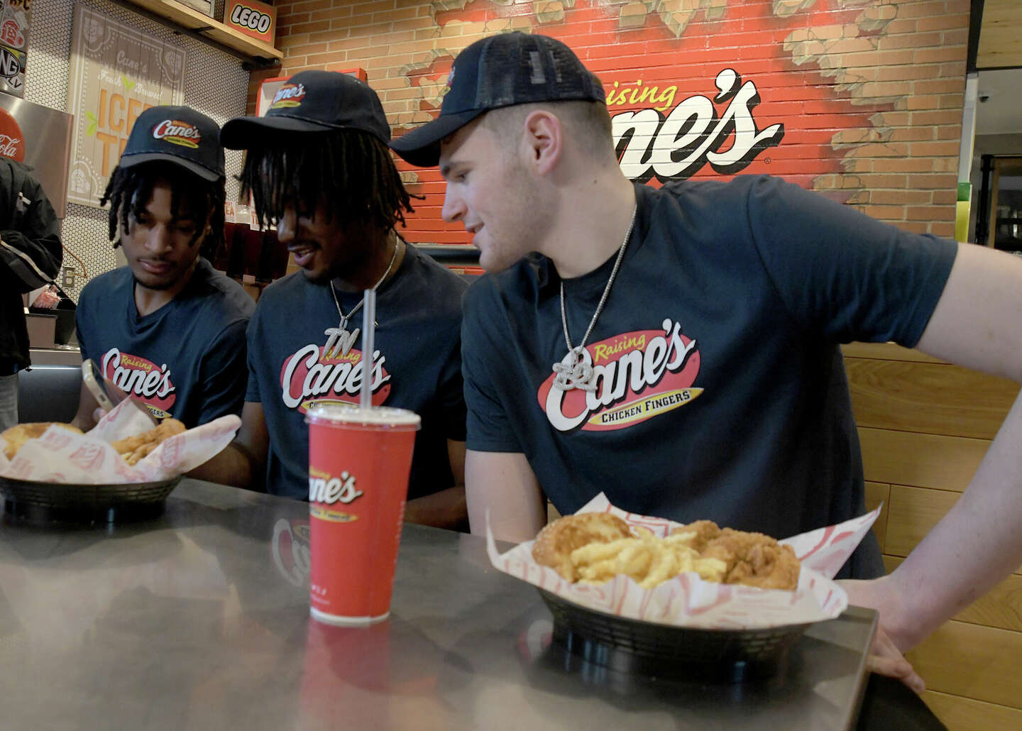 UConn basketball’s NBA hopefuls work a shift at Enfield Raising Cane’s