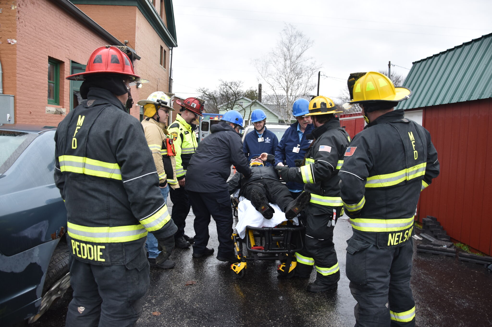 EMT students learn vehicle extrication with firefighters