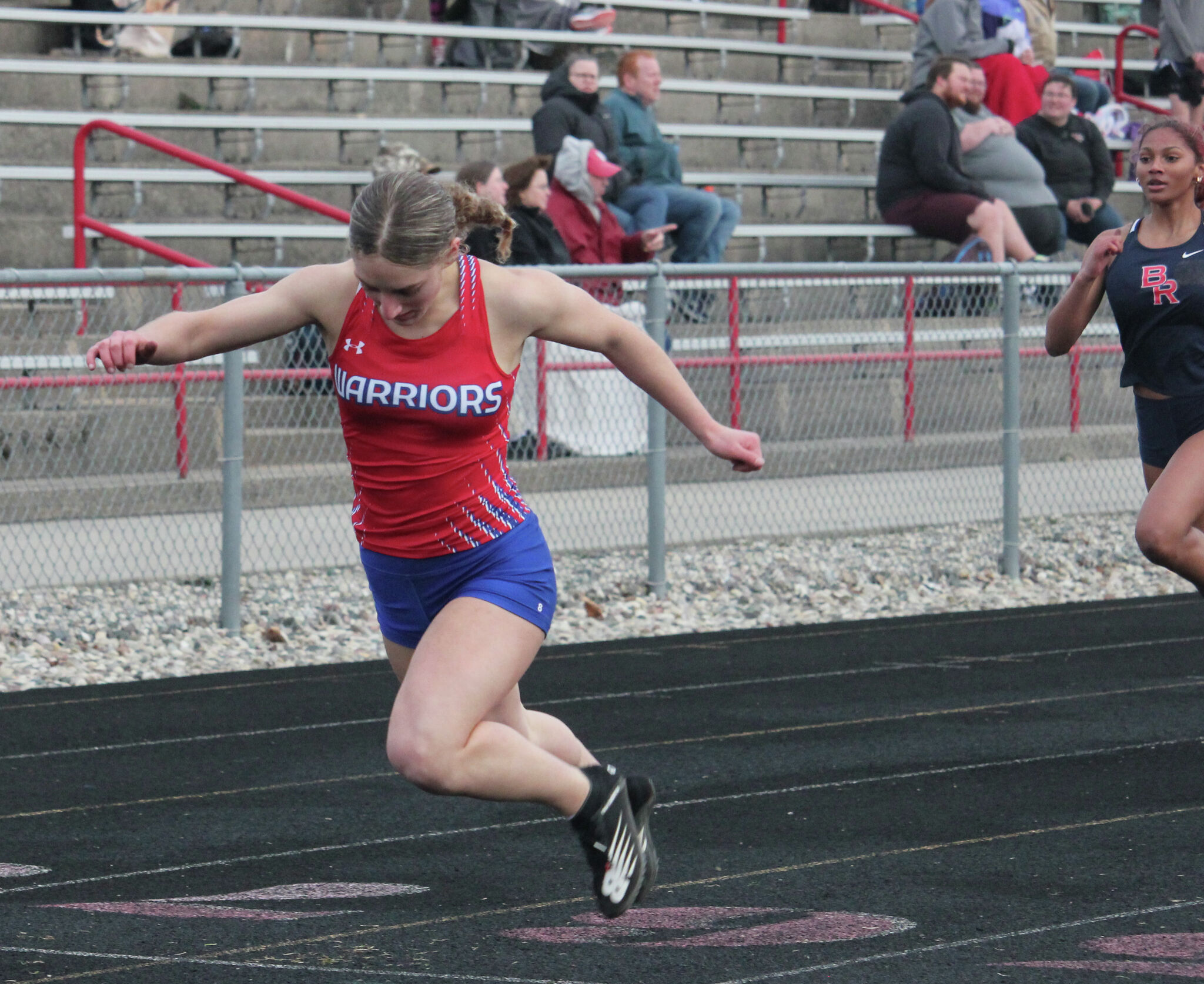 Track and field athletes battle windy conditions