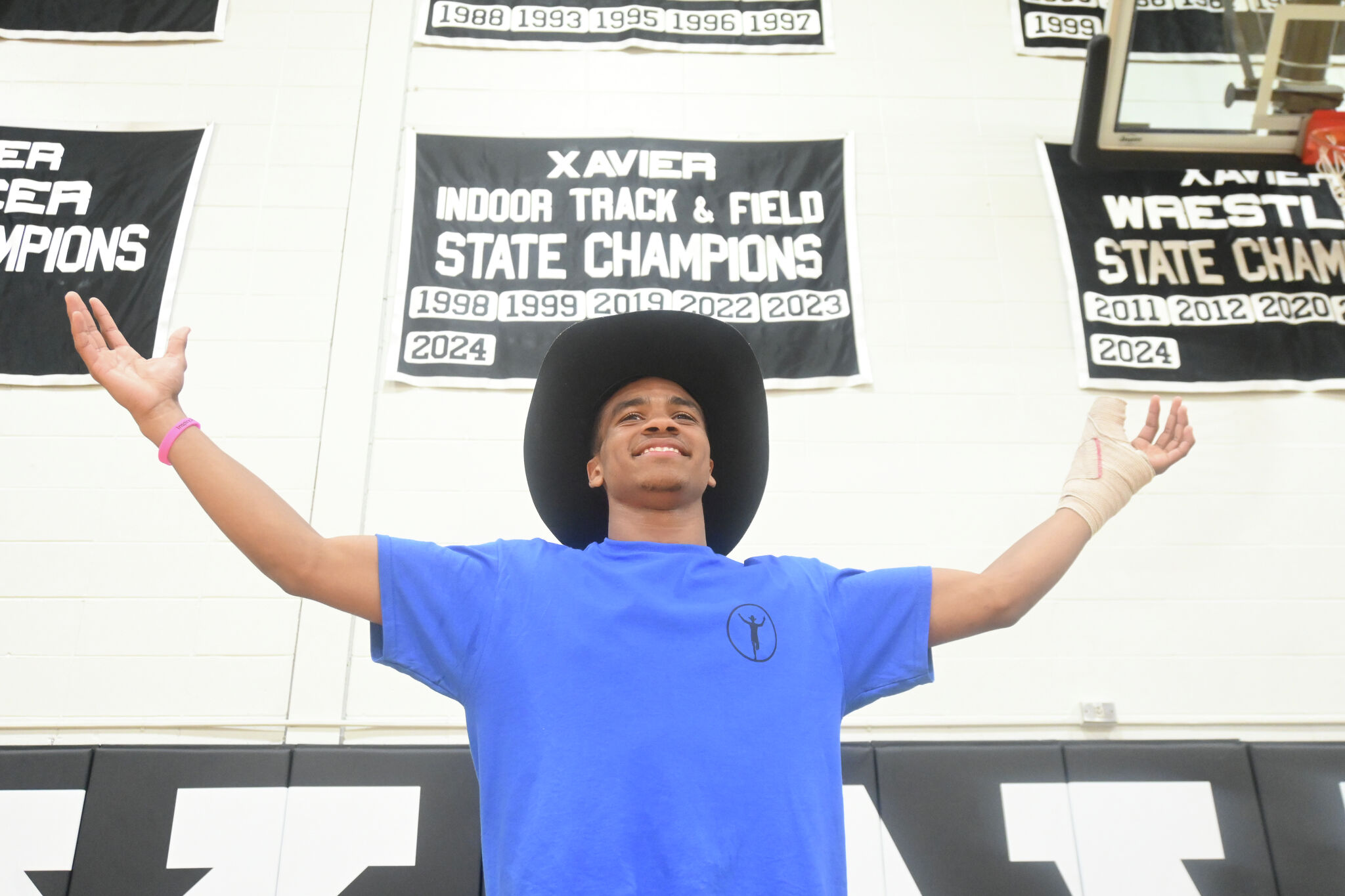 Xavier High School's Stylz Mitchell brings passion to track, football.