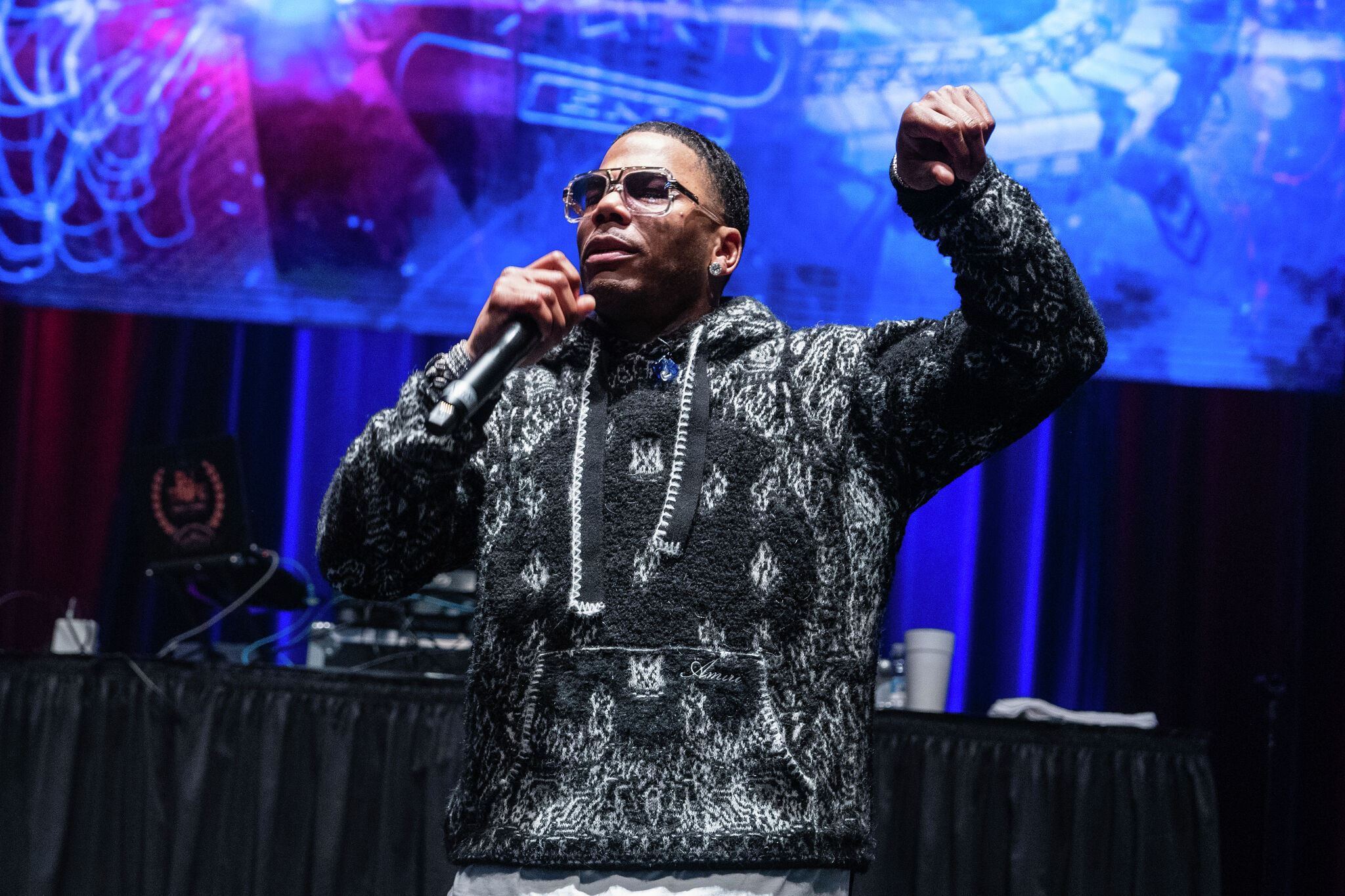 Rapper Nelly seen relaxing at Houston club’s VIP section