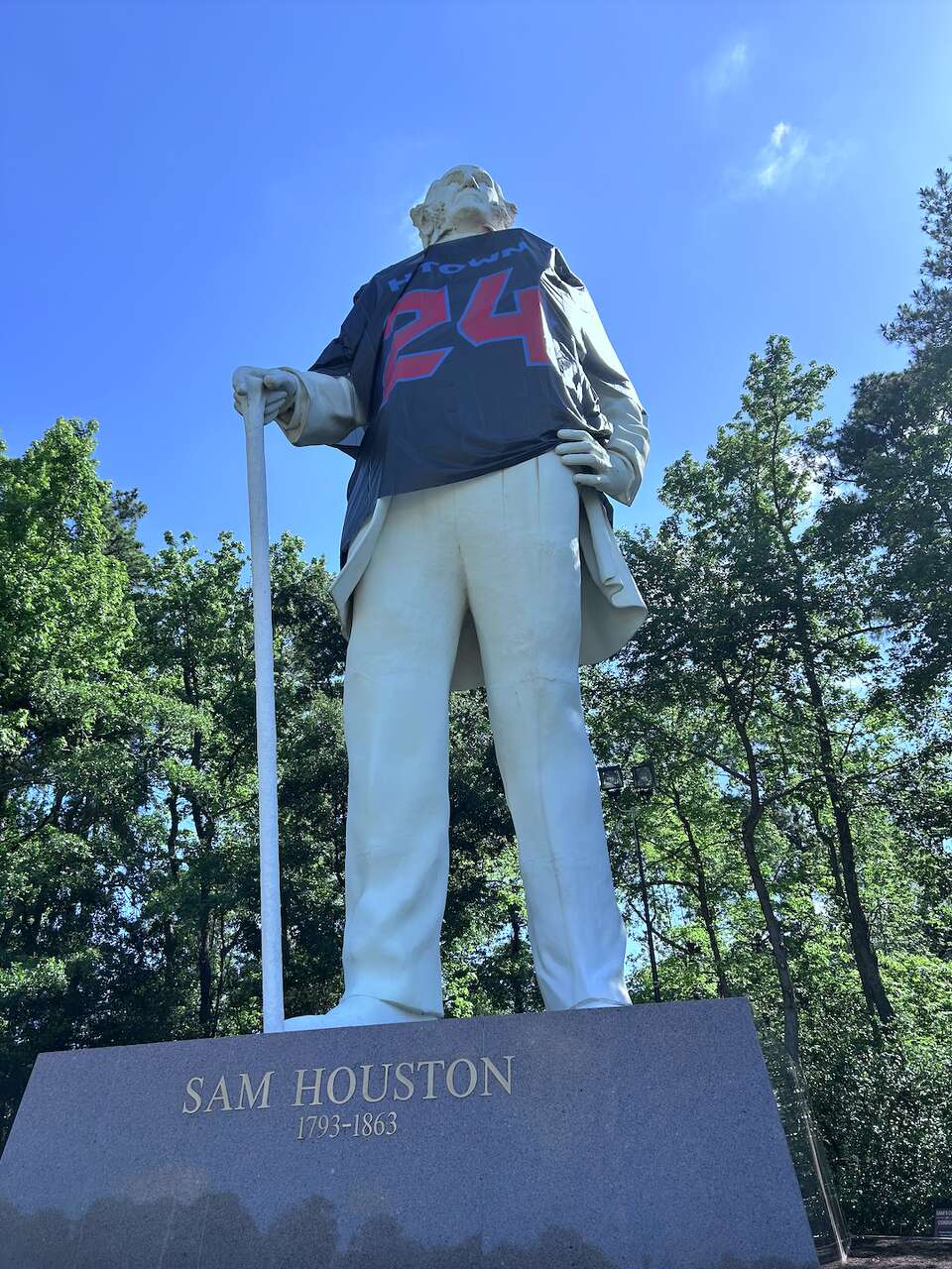 Statue of an American hero outfitted with Texans' NFL jersey