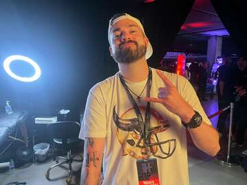 Houston radio figure gets free tattoo at Texans' party