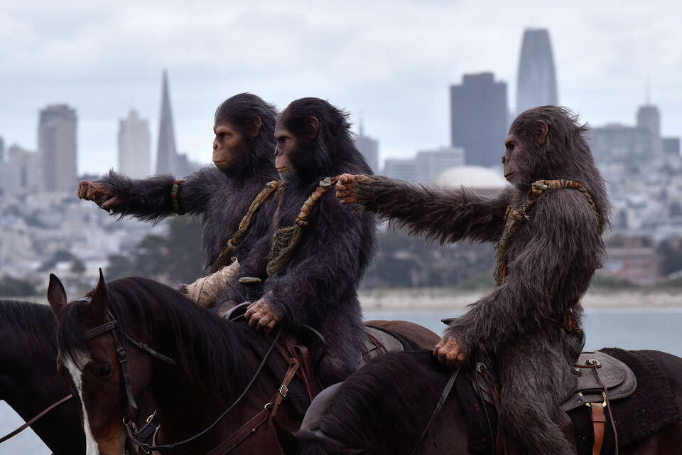 Costumed apes seen on horseback ride through San Francisco