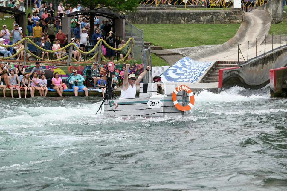 Competitors sail New Braunfels Thru the Chute Boat Race as icons